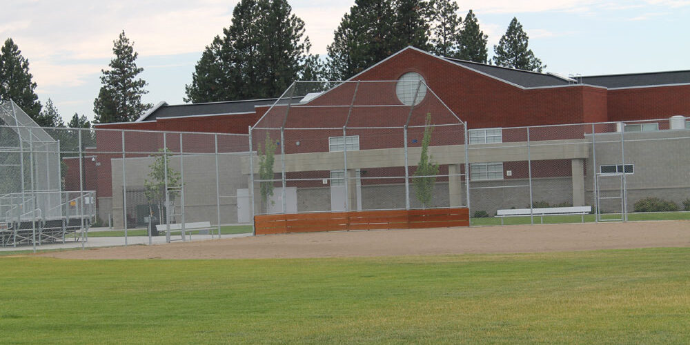 Chain Link School Backstop w/ 3 FT Wood Backboard | Northwest Fence Company